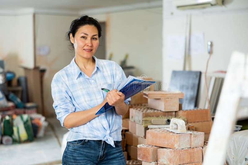Woman Checks the Completed Construction Work on Drawing Stock Photo ...