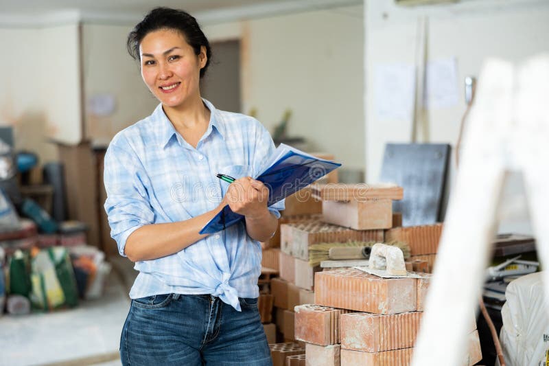 Woman Checks the Completed Construction Work on Drawing Stock Image ...