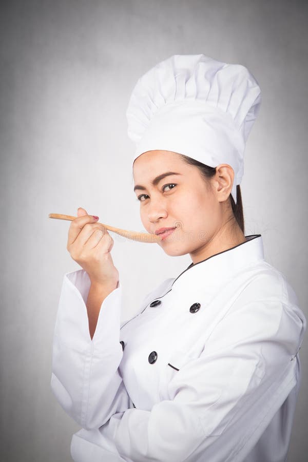 Woman chef holding spoon stock image. Image of attractive - 54540275
