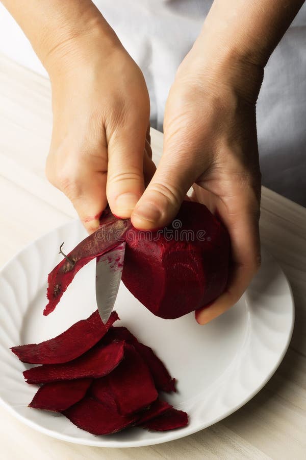 Woman chef prepare beets stock photo. Image of knife - 43671014