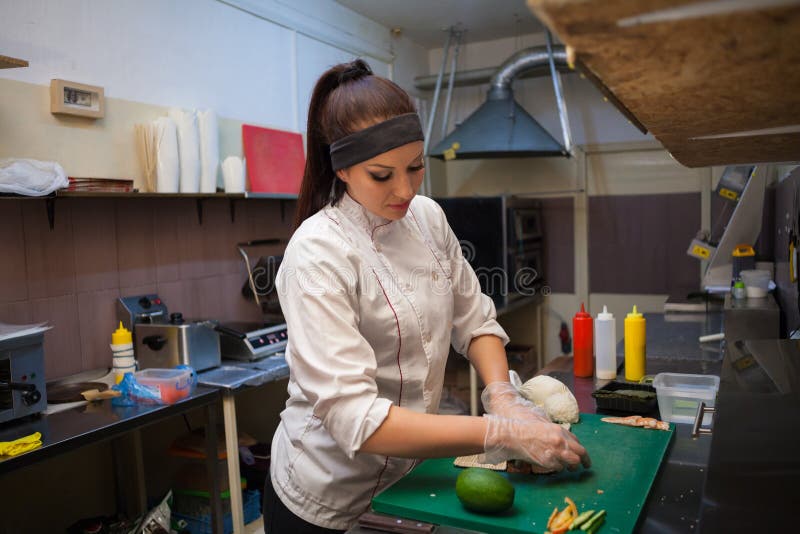 Beautiful Woman Chef Prepares Sushi on Restaurant Kitchen Stock Photo ...
