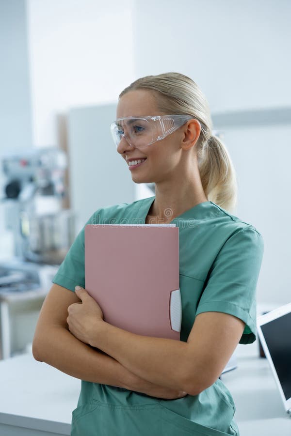 Woman Chemist Holding Document of Scientific Experiments while Standing ...