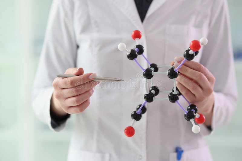 Woman Chemist Points Pen To Molecule Model Holding in Hand Stock Photo ...