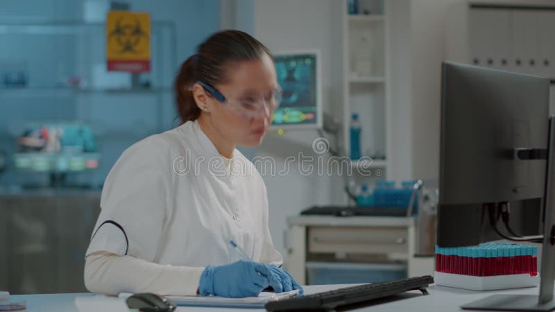 Chemist Taking Water with Pipette from Glass on Magnetic Rotator in Lab ...