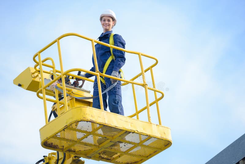 Man in Cherry Picker Bucket Pointing into Distance Stock Image - Image ...