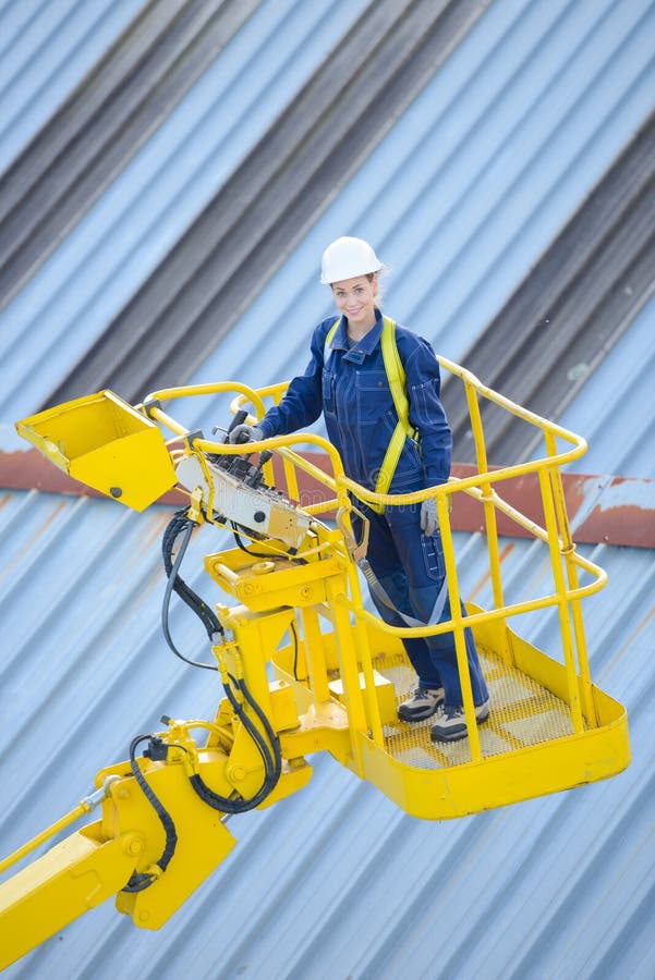 Man in Cherry Picker Bucket Pointing into Distance Stock Image - Image ...