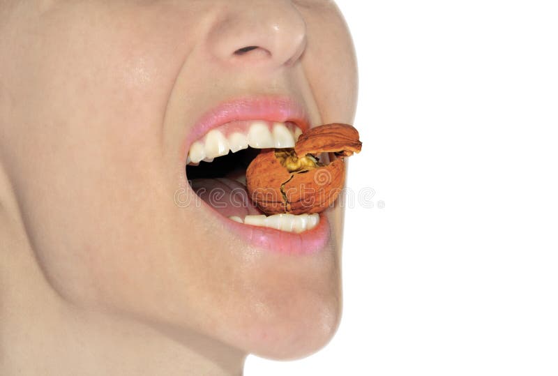 Woman chew a walnut stock image. Image of hard, brown - 28795897