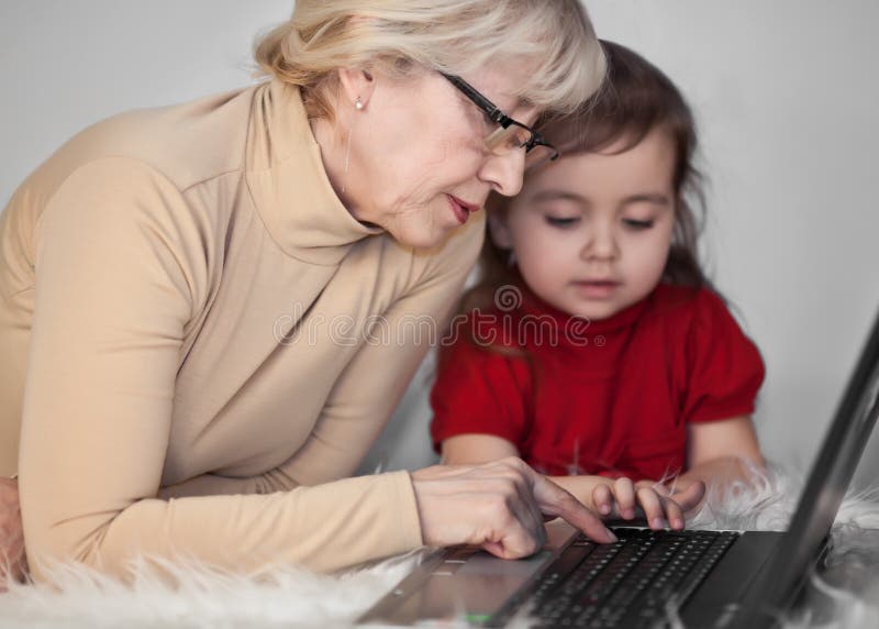 The Woman with the Child at the Computer Stock Image - Image of ...