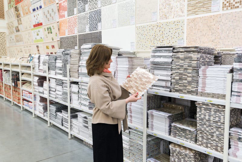 Woman Chooses a Ceramic Tile in a Store Stock Photo - Image of people ...