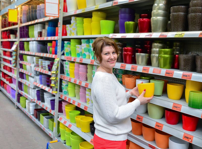 Woman Chooses a Flower Pot in Store Stock Image - Image of center, pink ...