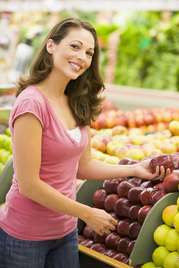 Woman Choosing Apples at Produce Counter Stock Image - Image of ...