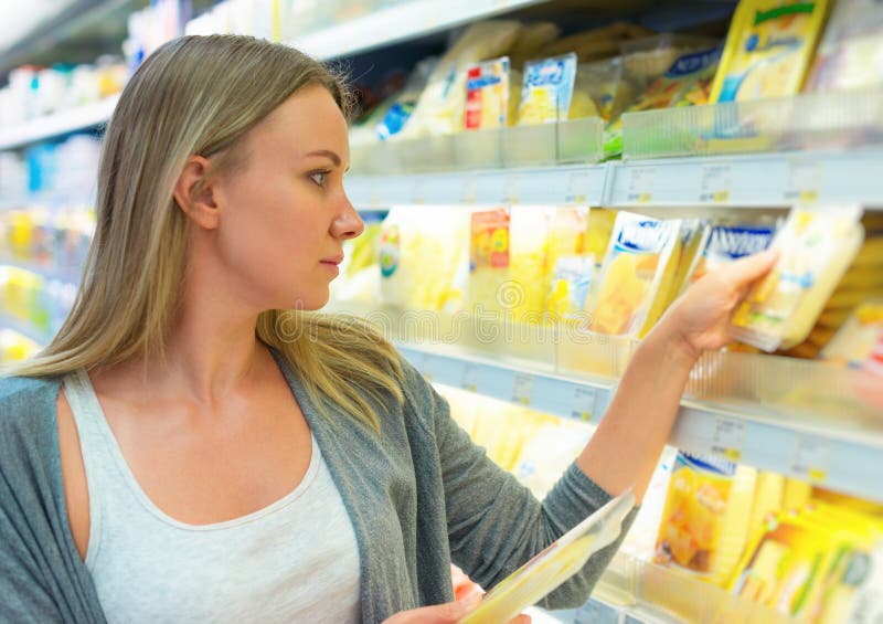 Woman choosing cheese. stock image. Image of commerce - 63316325