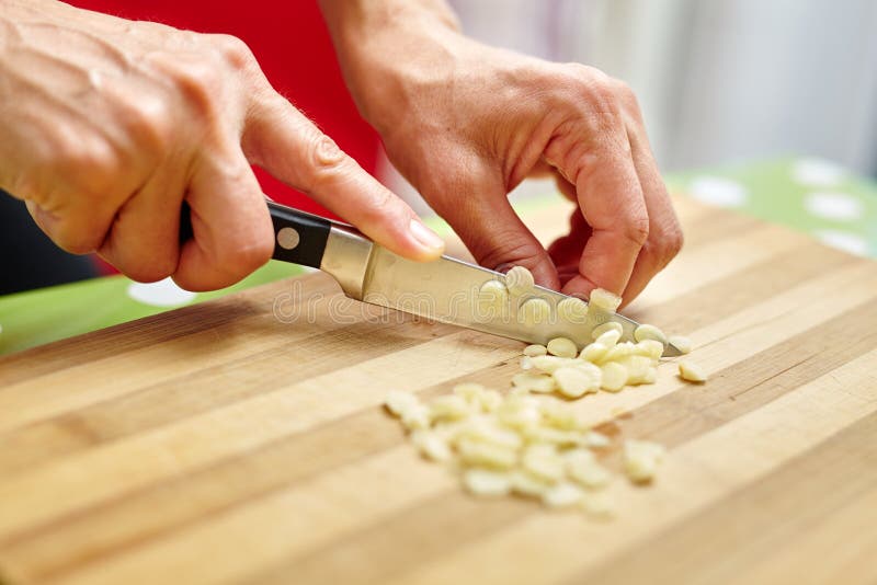 Woman chopping garlic stock image. Image of garlic, cuisine - 48543131