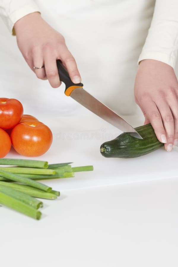 Woman Chopping Vegetables stock image. Image of 2530 - 29639137