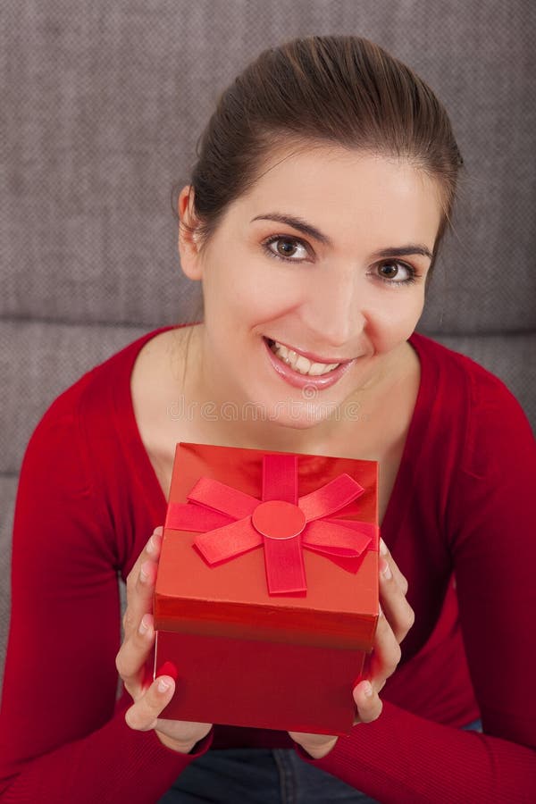 Woman with a Christmas Present Stock Photo - Image of festive, colour ...