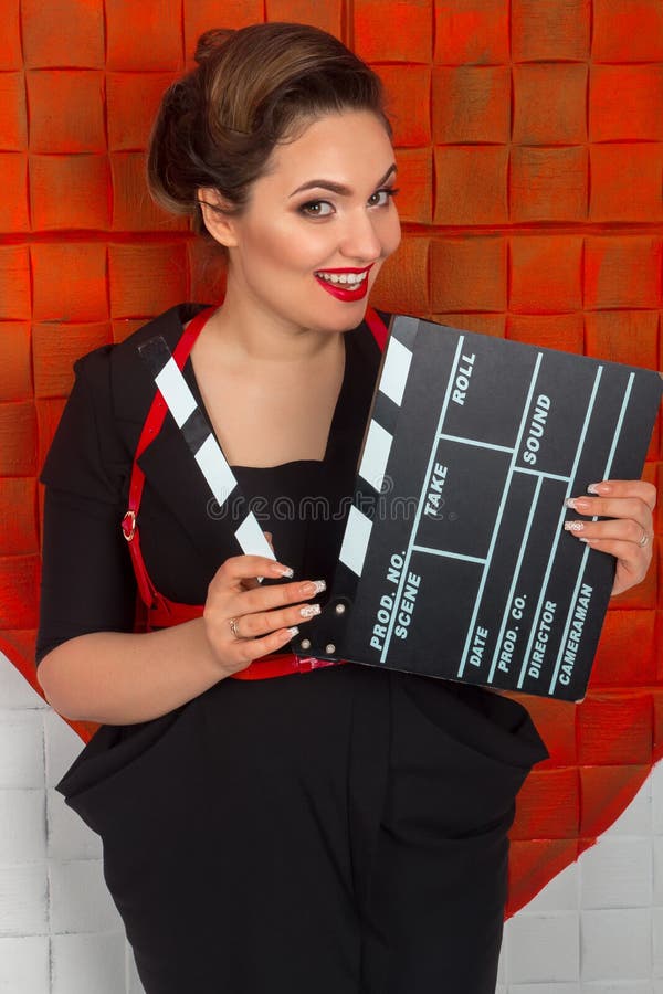 Woman with the clapper stock photo. Image of black, adult - 75929224