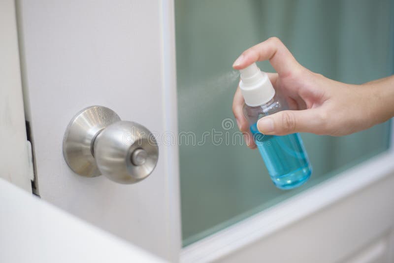 Woman is Cleaning Door Handle with Alcohol Spray Stock Photo - Image of ...