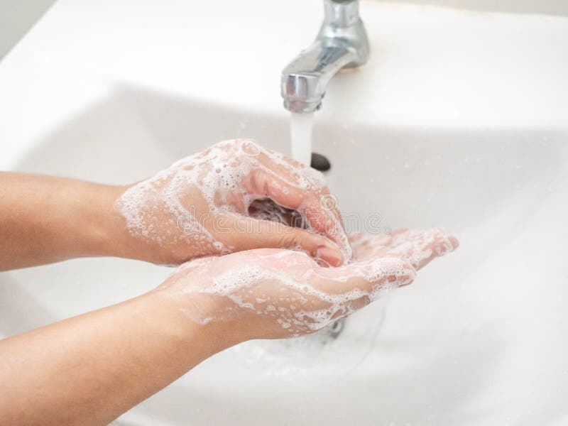 A Woman Cleaning Hands Use Hand Soap until White Bubbles Form in the ...
