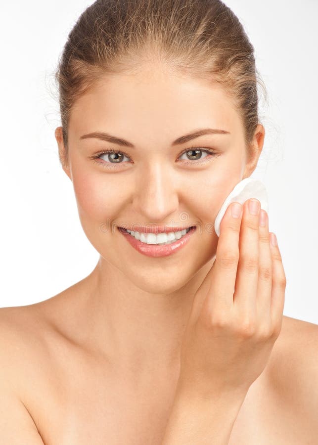 Woman cleaning her face stock photo. Image of cleaning - 19886276