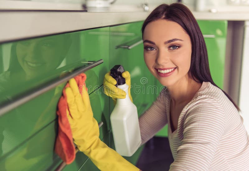 Woman cleaning her kitchen stock photo. Image of concept - 80099536