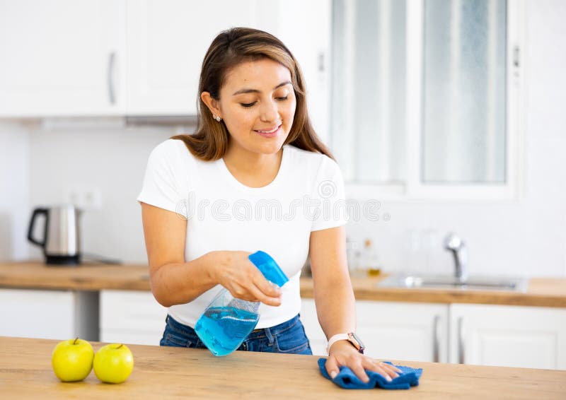 Woman Cleaning Kitchen Countertop with Cleaning Spray and Rag Stock ...