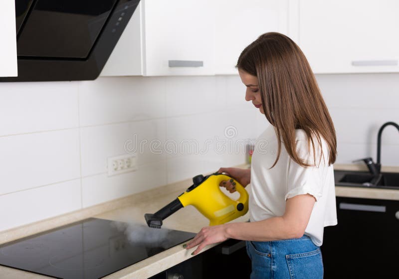 Woman Cleaning Kitchen with Steam Cleaner Stock Photo - Image of person ...