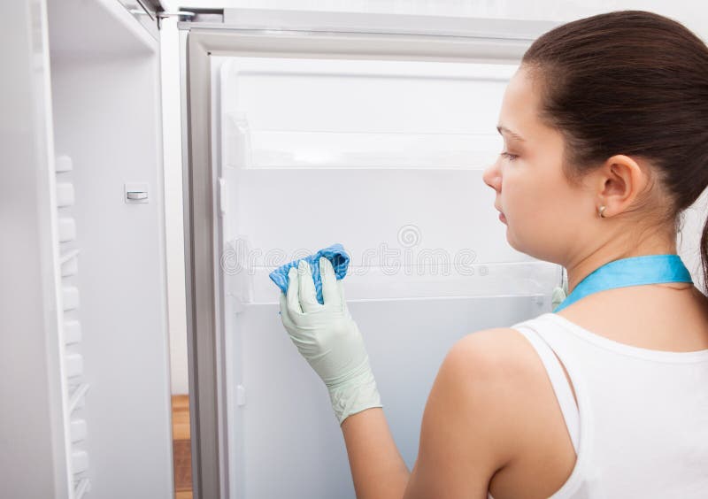 Woman Cleaning Refrigerator Stock Photo - Image of close, object: 52429846