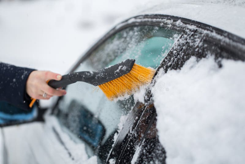 Woman Cleaning Snow from the Car in the Winter. Stock Photo - Image of ...