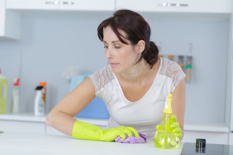 Woman cleaning table top stock image. Image of wife - 100425233