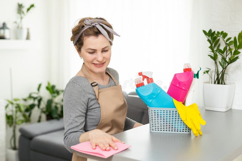 Woman Cleaning Table Using Rag and Diffuser at Home. Stock Photo ...