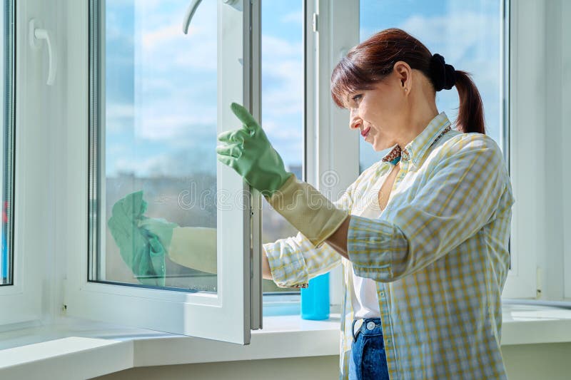 Woman Cleaning Windows Home Using Spray Microfiber Cloth Stock Photos ...