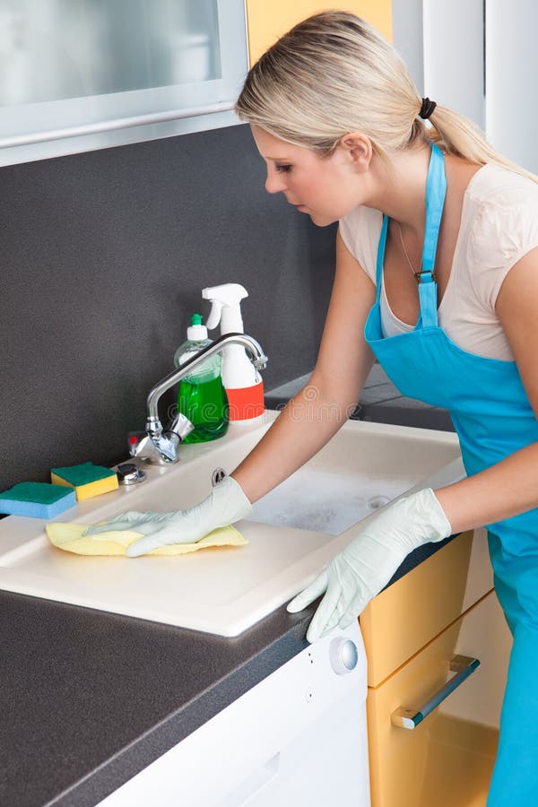 Woman cleaning worktop stock photo. Image of housekeeping - 44603250