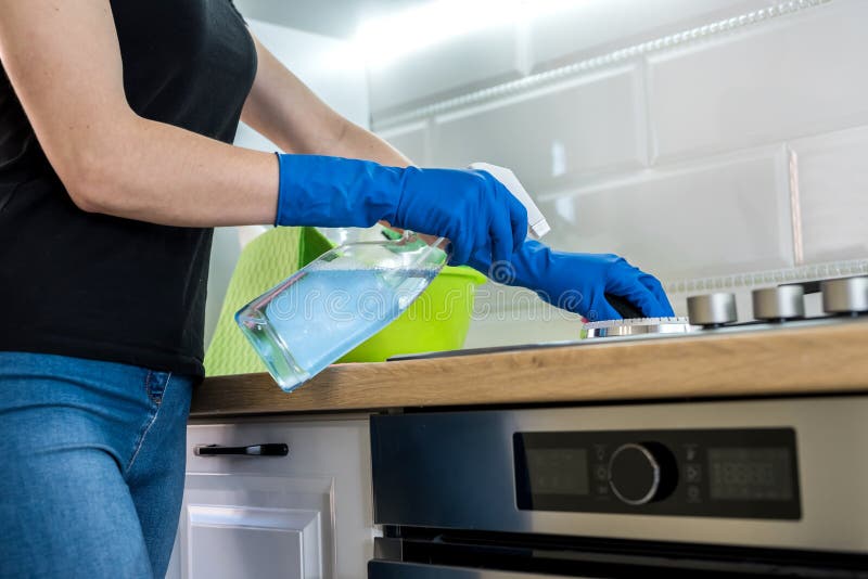 Woman Cleans in the Kitchen. Concept of Cleanliness and Order Stock ...