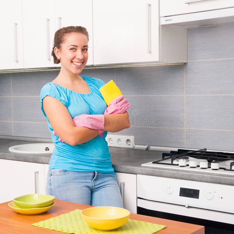 Woman cleans the kitchen stock photo. Image of house - 31164940