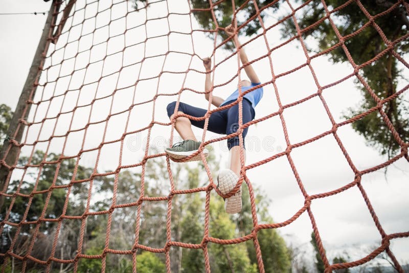 Woman Climbing a Net during Obstacle Course Stock Photo - Image of ...