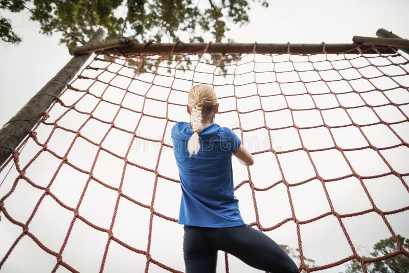 Woman Climbing a Net during Obstacle Course Stock Image - Image of ...