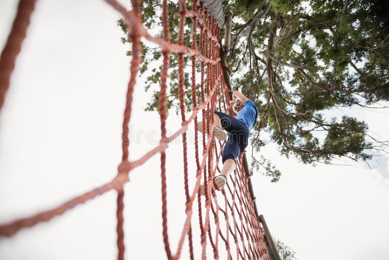 Woman Climbing a Net during Obstacle Course Stock Photo - Image of ...