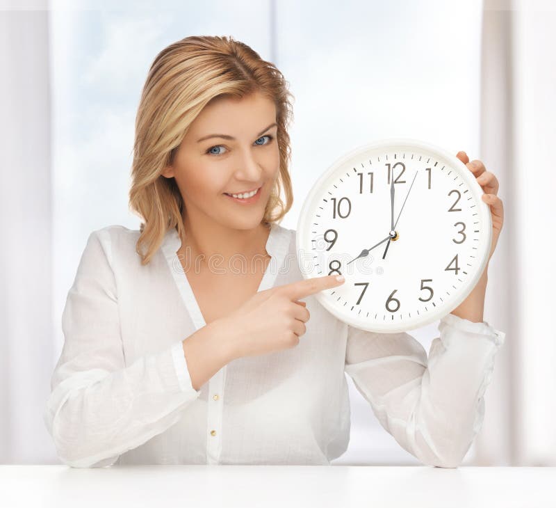 Woman with clock stock image. Image of casual, lady, attractive - 38342429
