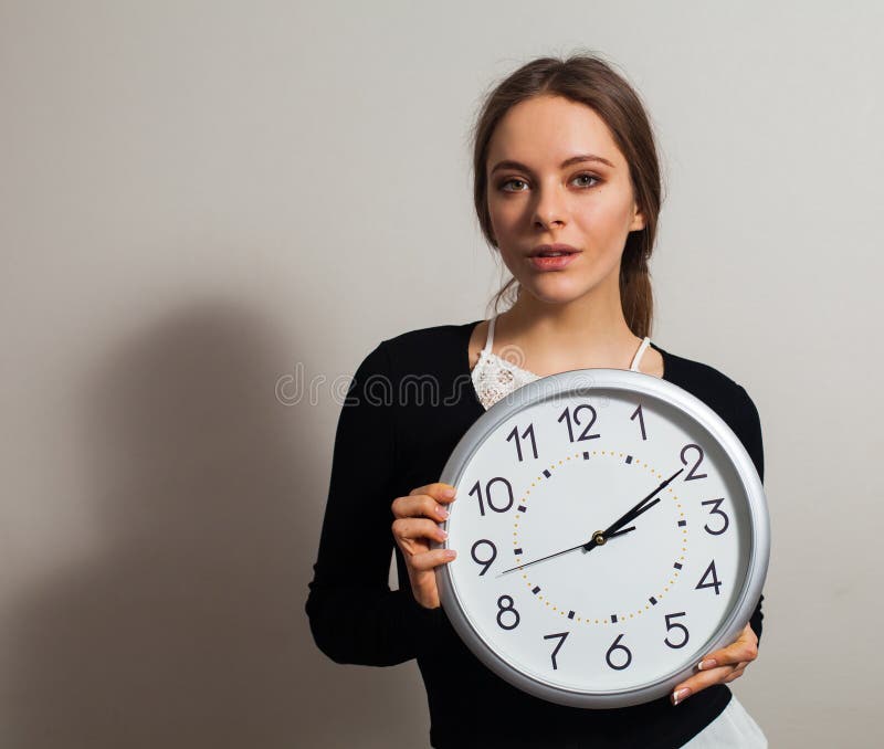 Woman with clock stock photo. Image of businesswoman - 83017582