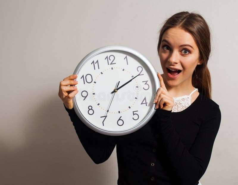 Woman with clock stock image. Image of holding, deadline - 83018243