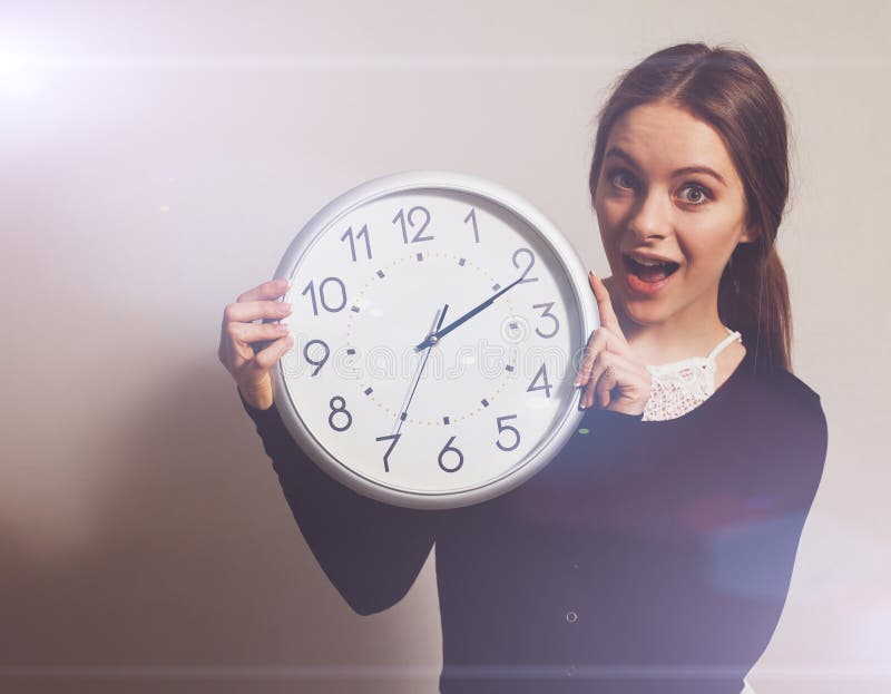 Woman with clock stock image. Image of worker, adult - 83021801