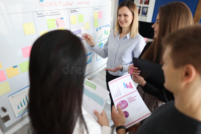 Woman Coach Explaining Information at Blackboard Group of Students ...