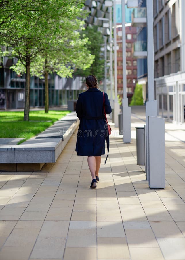 Woman in Coat Walking on the Street on Spring Day Stock Image - Image ...