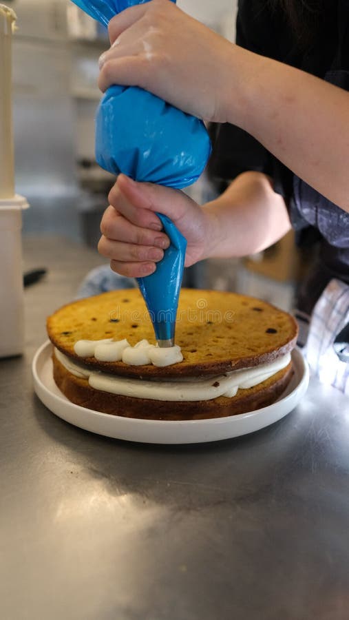 Woman Coating the Cake with Icing Stock Photo - Image of home, baked ...