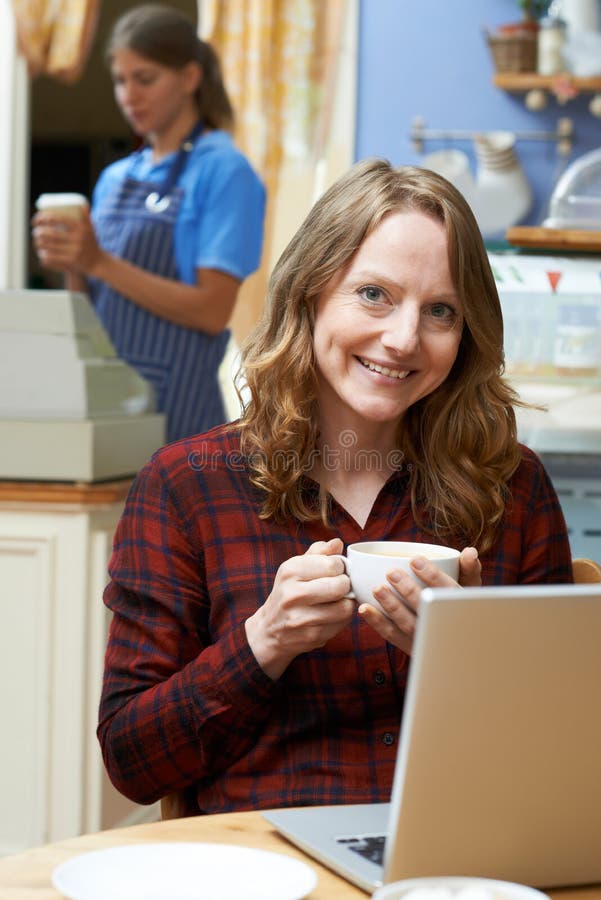 Woman in Coffee Shop Using Laptop Computer Stock Image - Image of ...