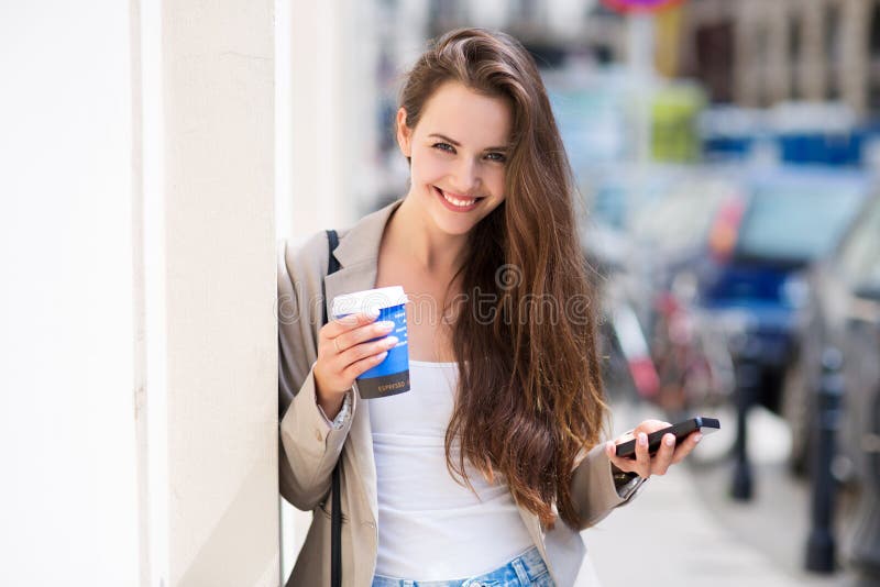 Woman with coffee to go stock photo. Image of adult, city - 67589014
