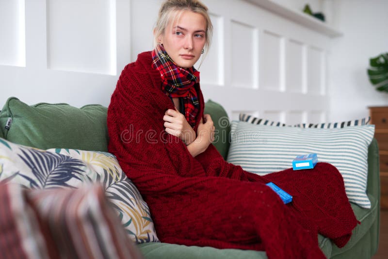 A Woman with a Cold Sits on the Sofa at Home Stock Image - Image of ...