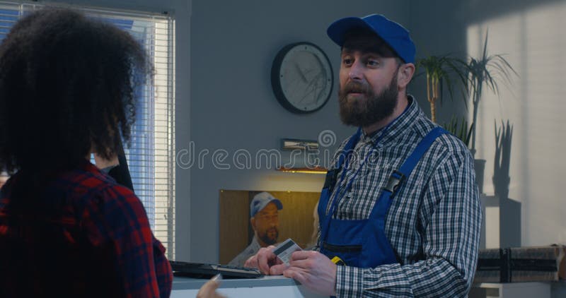 Woman Collecting a Package in a Delivery Center Stock Photo - Image of ...