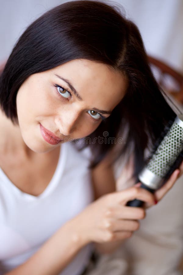 Woman comb her hair stock image. Image of makeup, hairdresser - 21412033
