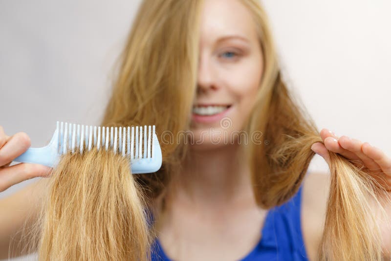 Woman Combing Long Blonde Hair Stock Image - Image of combing, teenage ...